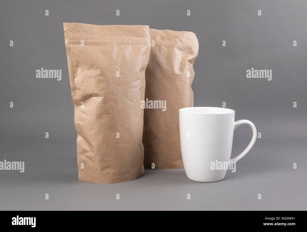 Mockup craft paper pouch bag over gray Stock Photo - Alamy