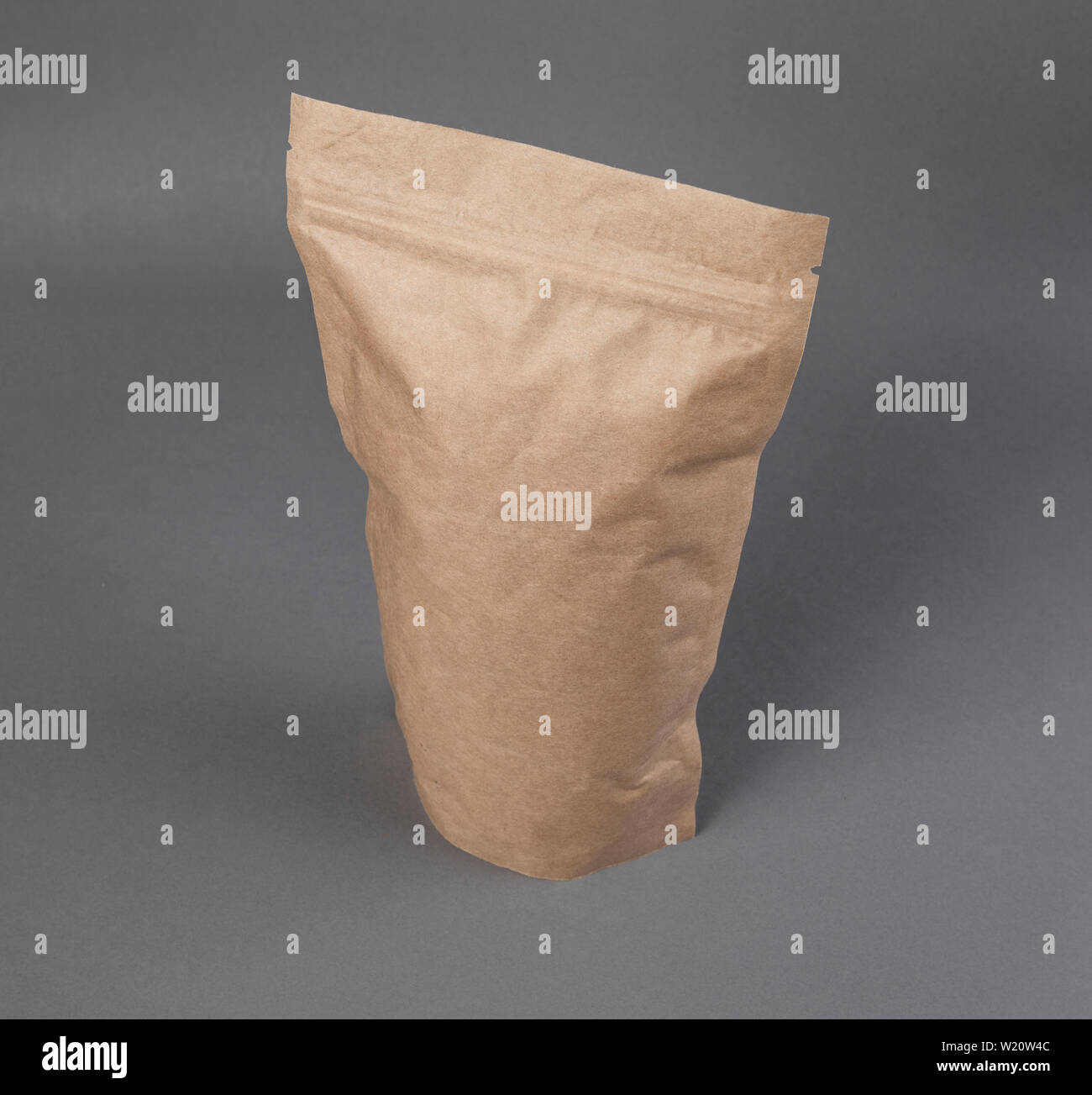 Mockup craft paper pouch bag over gray Stock Photo - Alamy