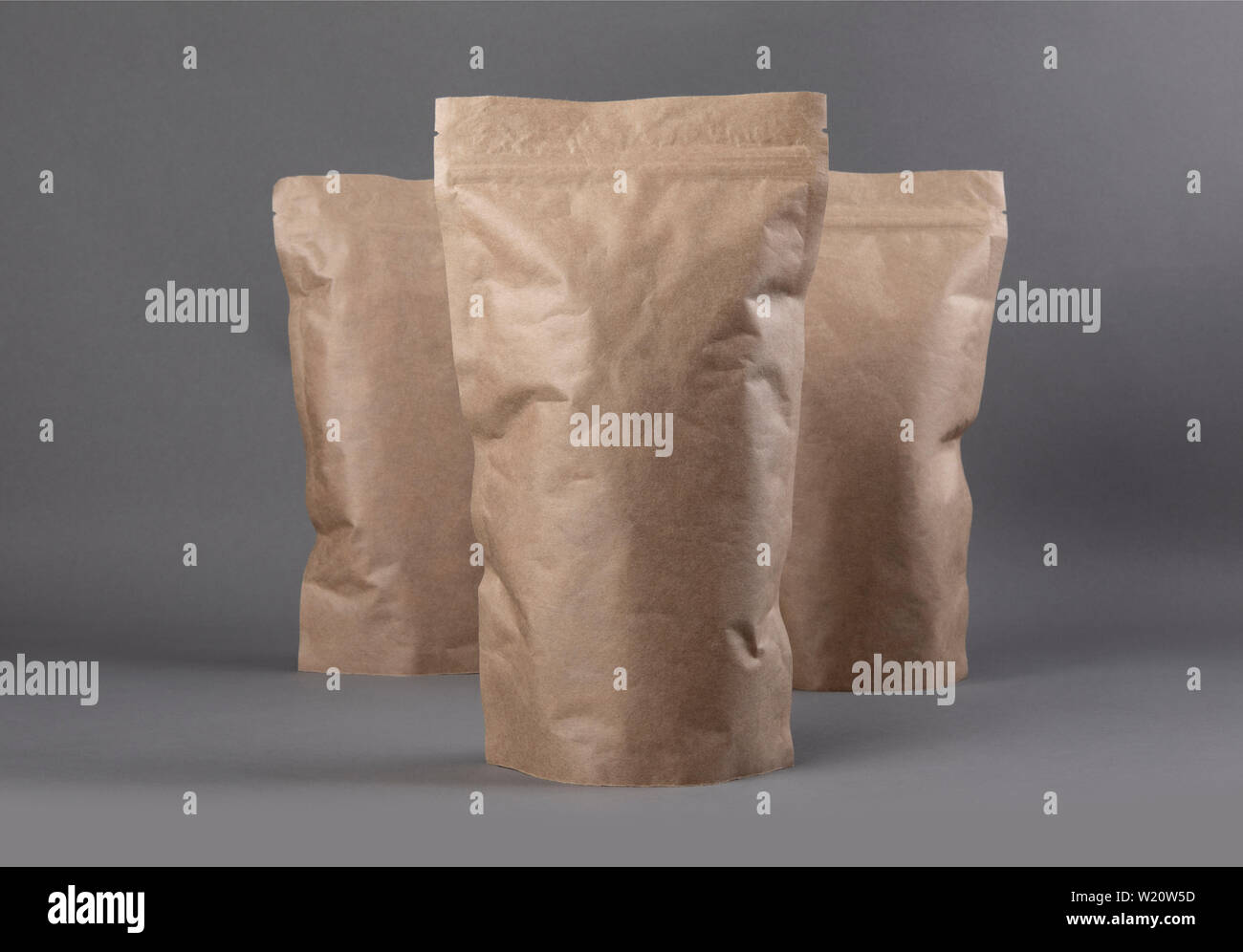 Mockup craft paper pouch bag over gray Stock Photo - Alamy