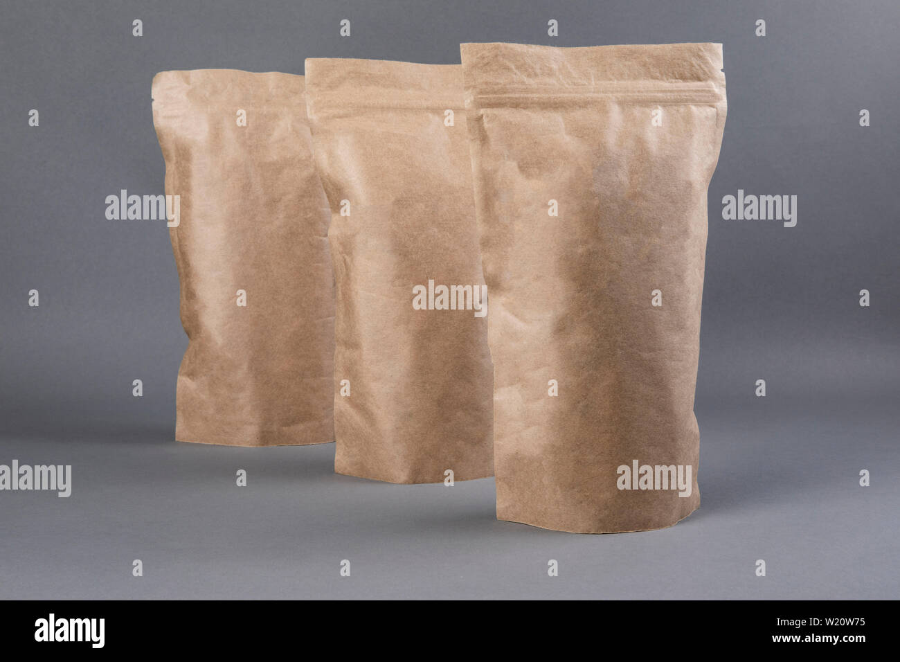 Mockup craft paper pouch bag over gray Stock Photo - Alamy
