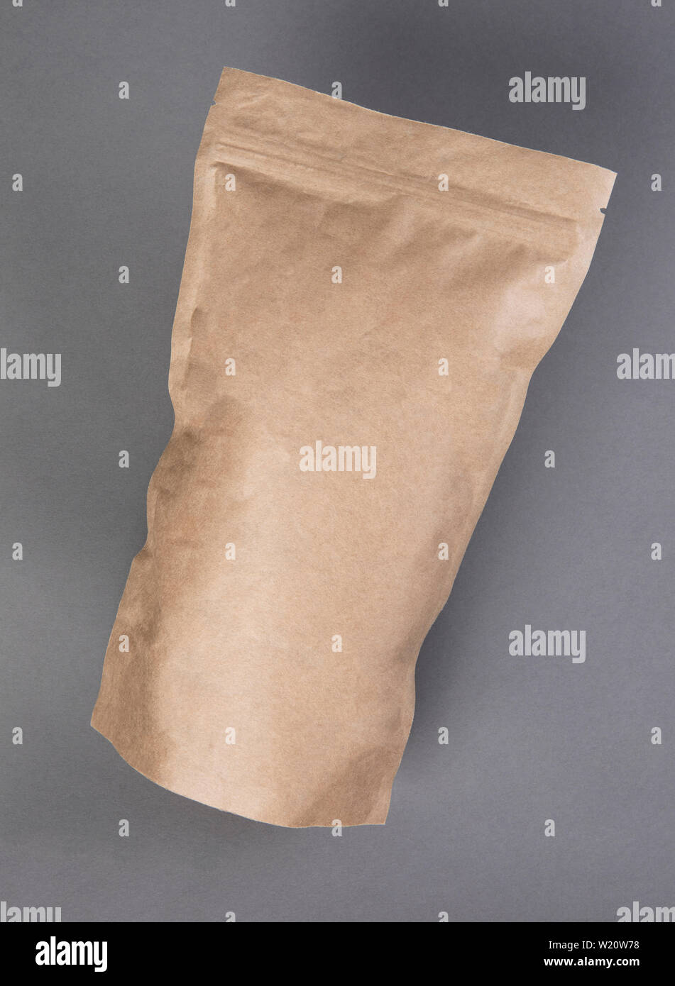 Mockup craft paper pouch bag over gray Stock Photo - Alamy