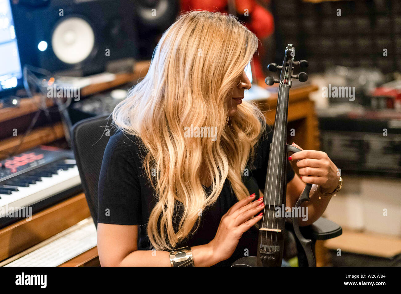 Music recording session in modern music studio. The equipment including ...