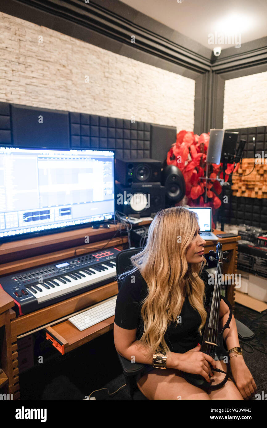 Music recording session in modern music studio. The equipment including ...