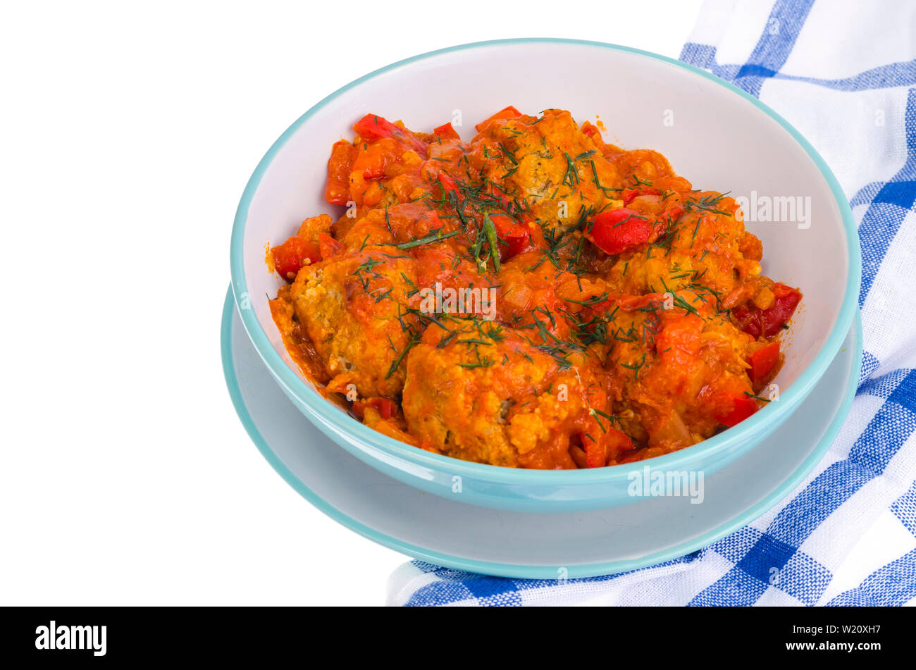 Meatballs meat, fish in tomato sauce with vegetables Stock Photo - Alamy