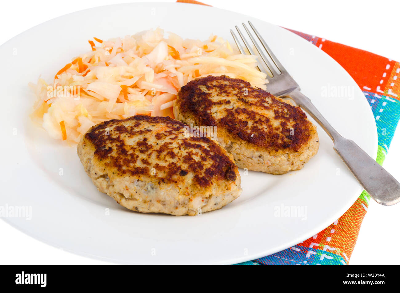 Pickled cabbage with cutlets oa white plate Stock Photo - Alamy