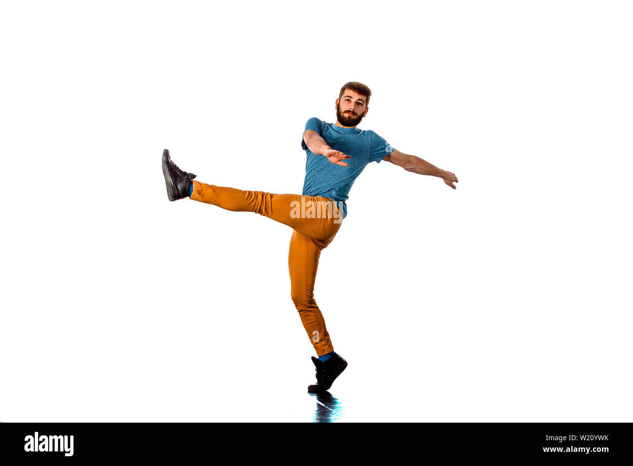 Happy young man dancing against plain white background Stock Photo - Alamy