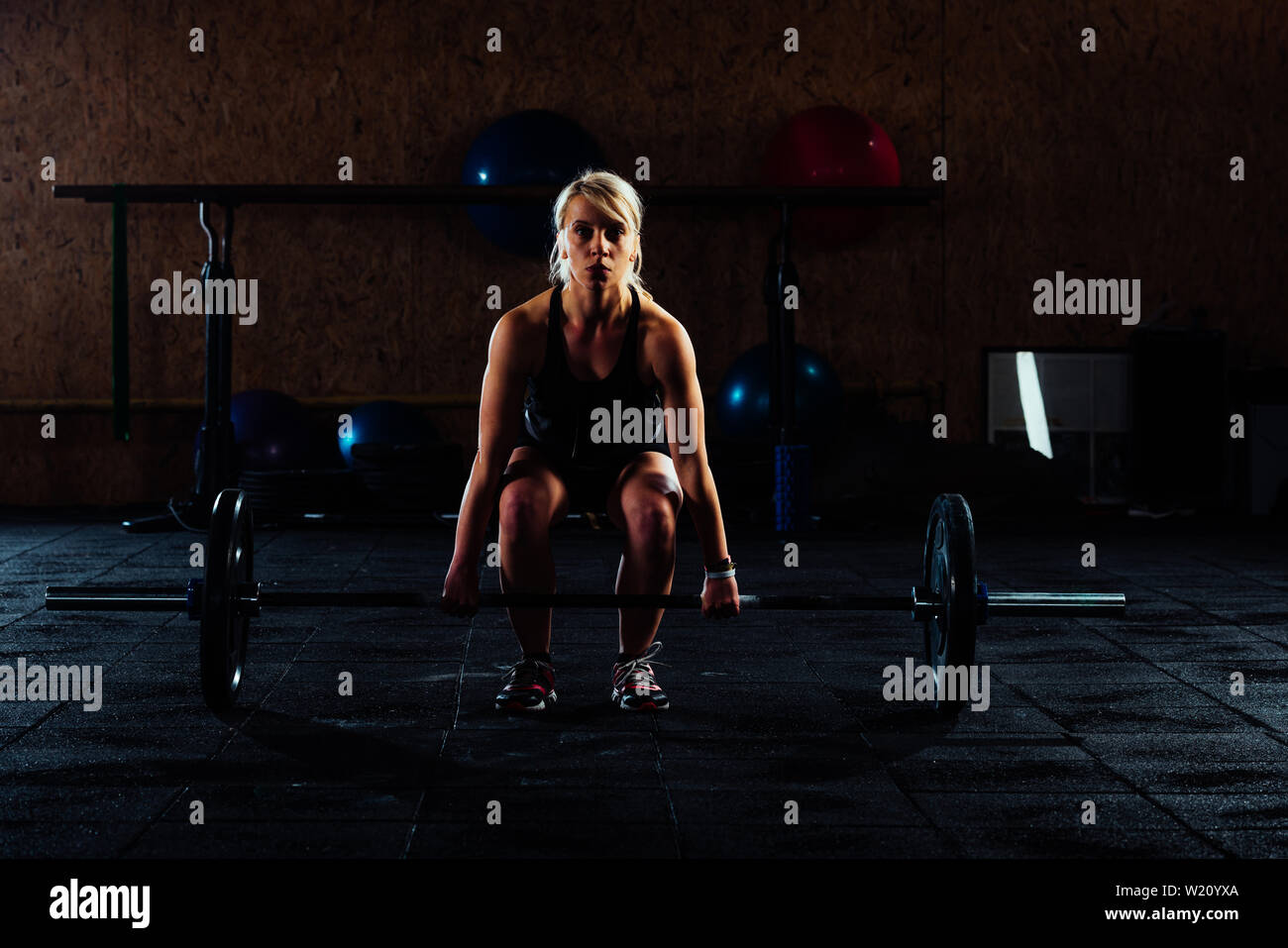 Strong woman is having gym workout routine Stock Photo - Alamy