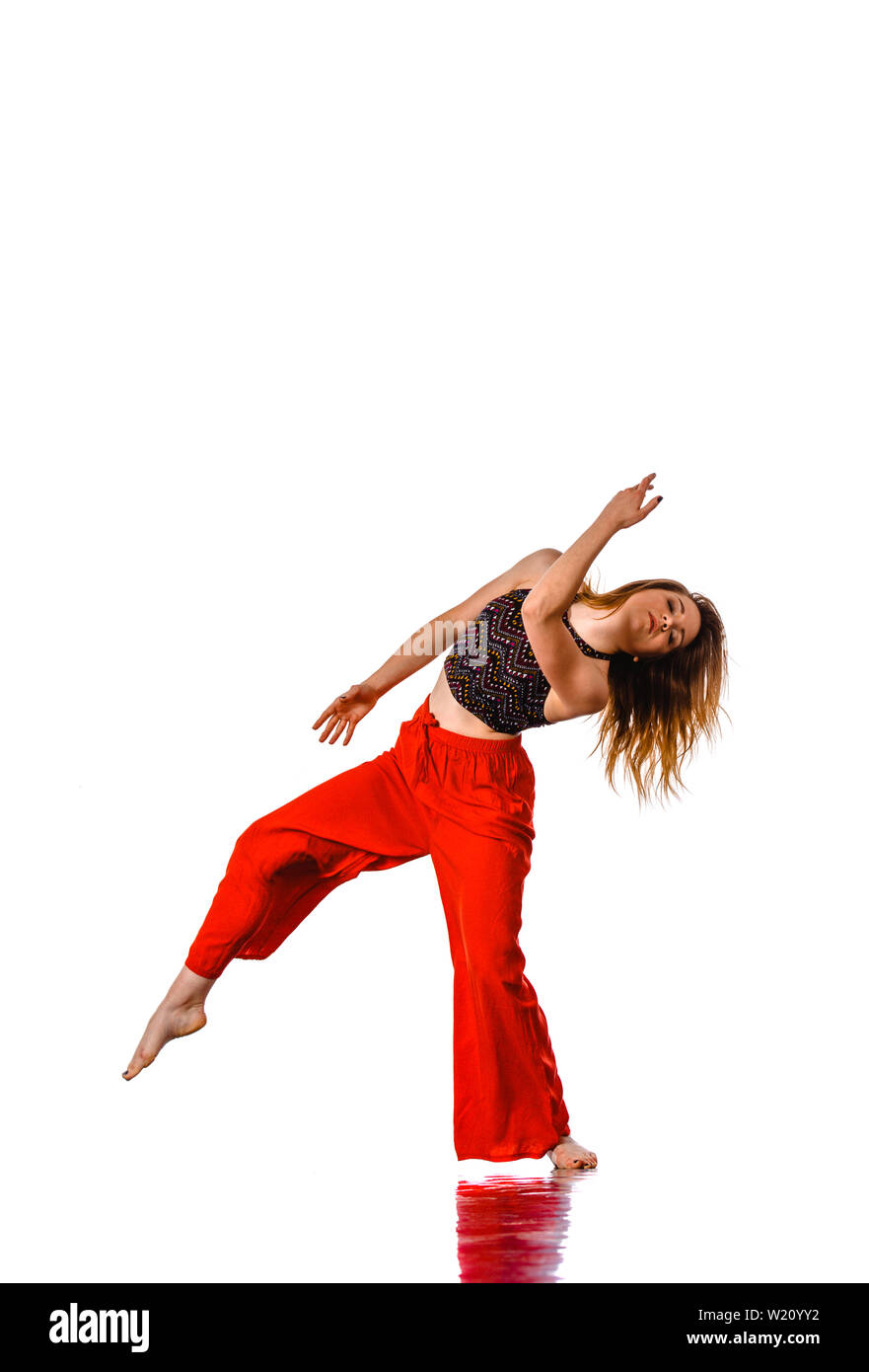 Joyful passionate woman dancing dance aerobics with raised arms. Full ...