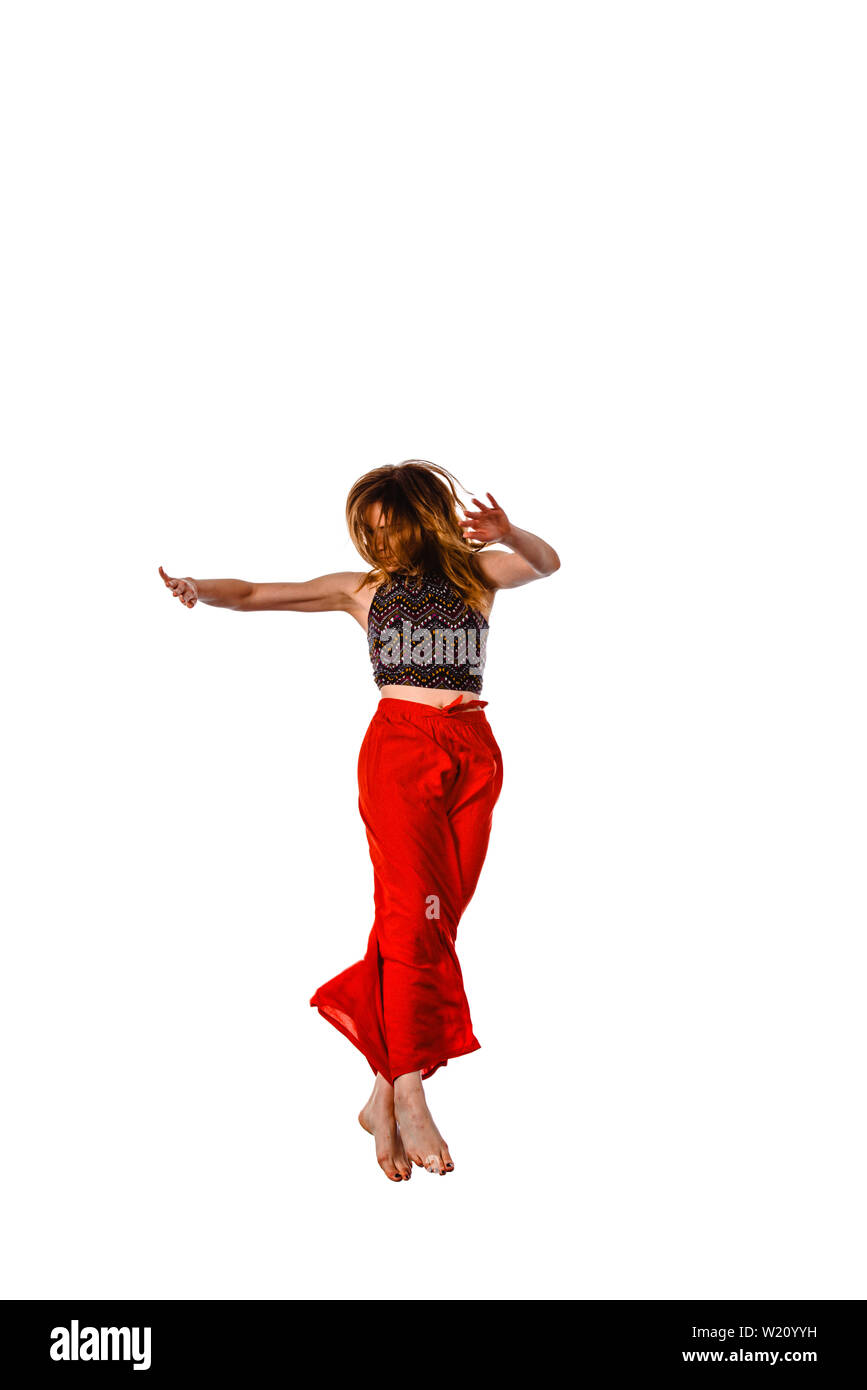 Happy girl working out dance standing with hands up. Dynamic woman ...