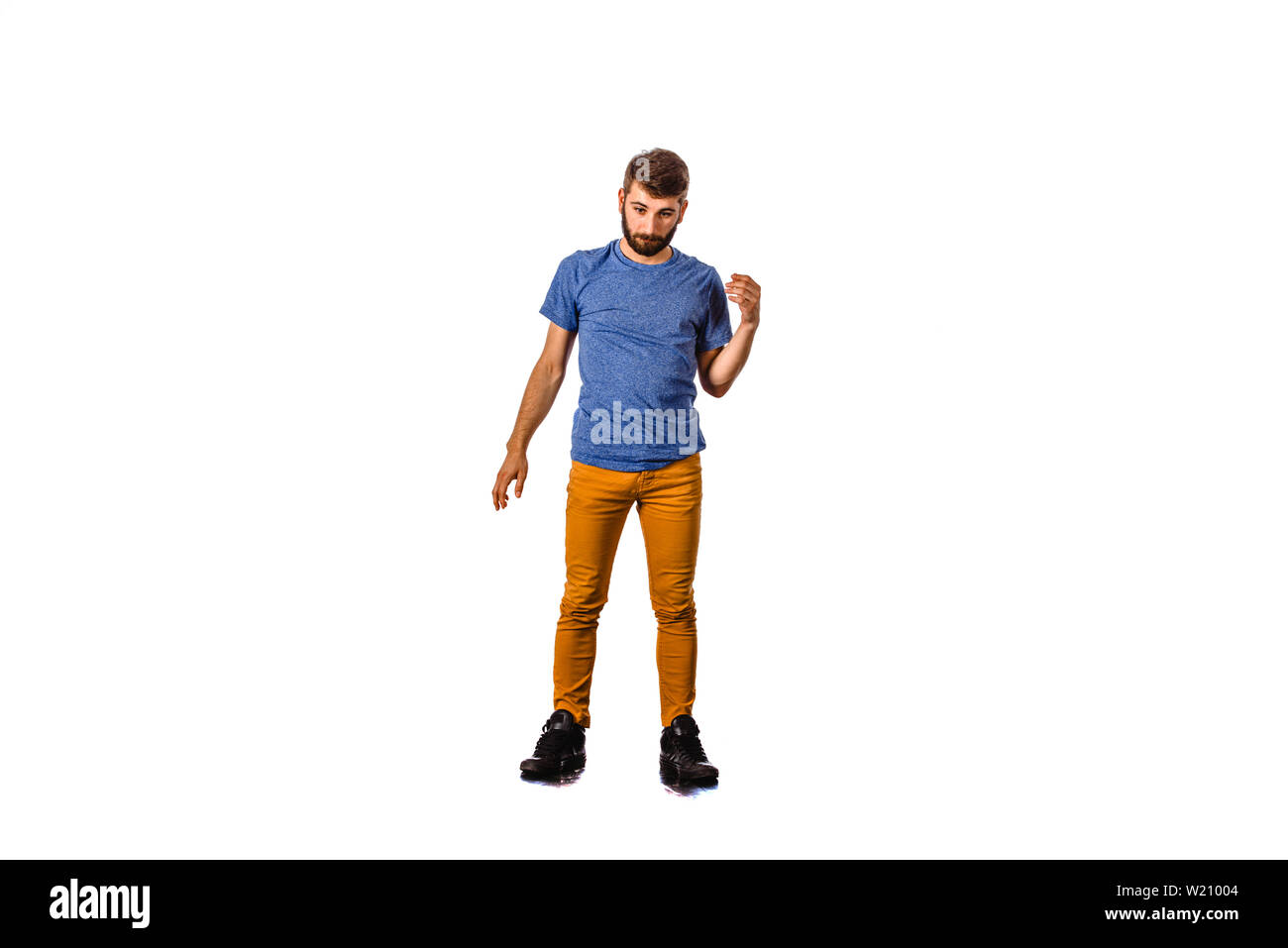 Portrait of a young man dancing of joy. Isolated image on white ...