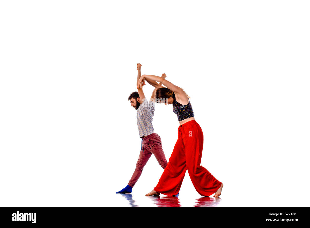 Ballet dancers in movement. Modern style dancers dancing contemporary ...