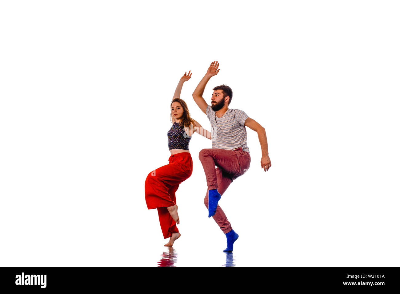 Dancers in action. Young couple of casual dancers performing modern ...