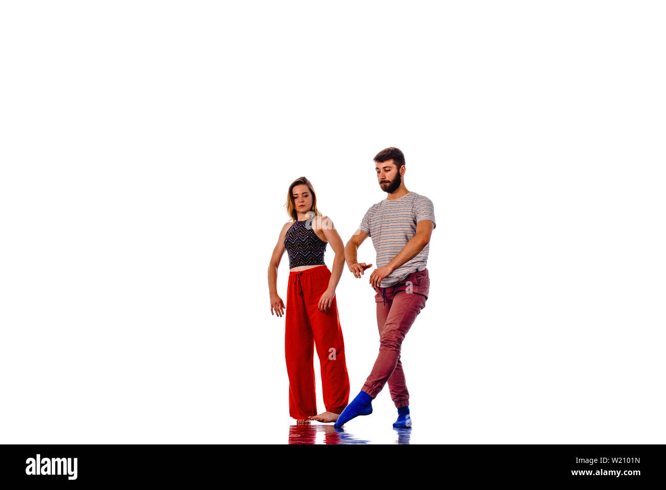 Romantic couple dancing together in studio, isolated on white ...