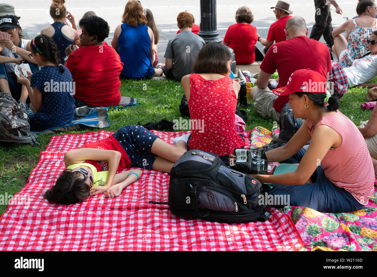 Parade-goers line up for the Independence Day Parade along Constitution ...