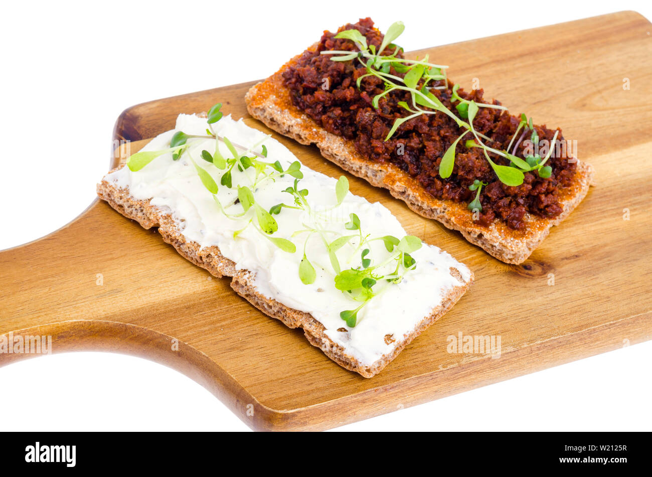 Healthy food. Rye crisps with young green sprouts Stock Photo - Alamy