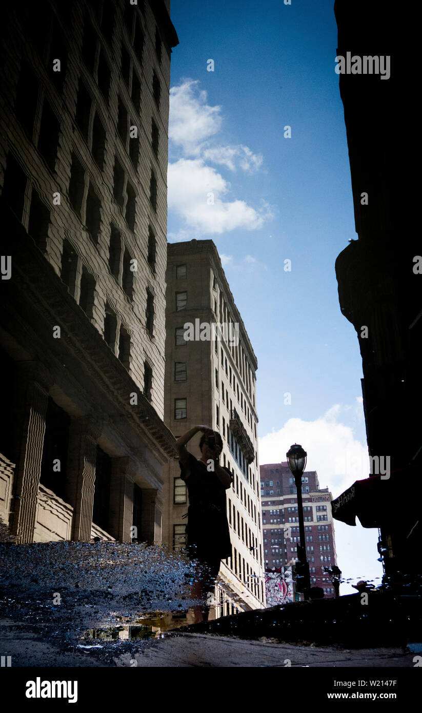 Reflection woman puddle city hi-res stock photography and images - Alamy