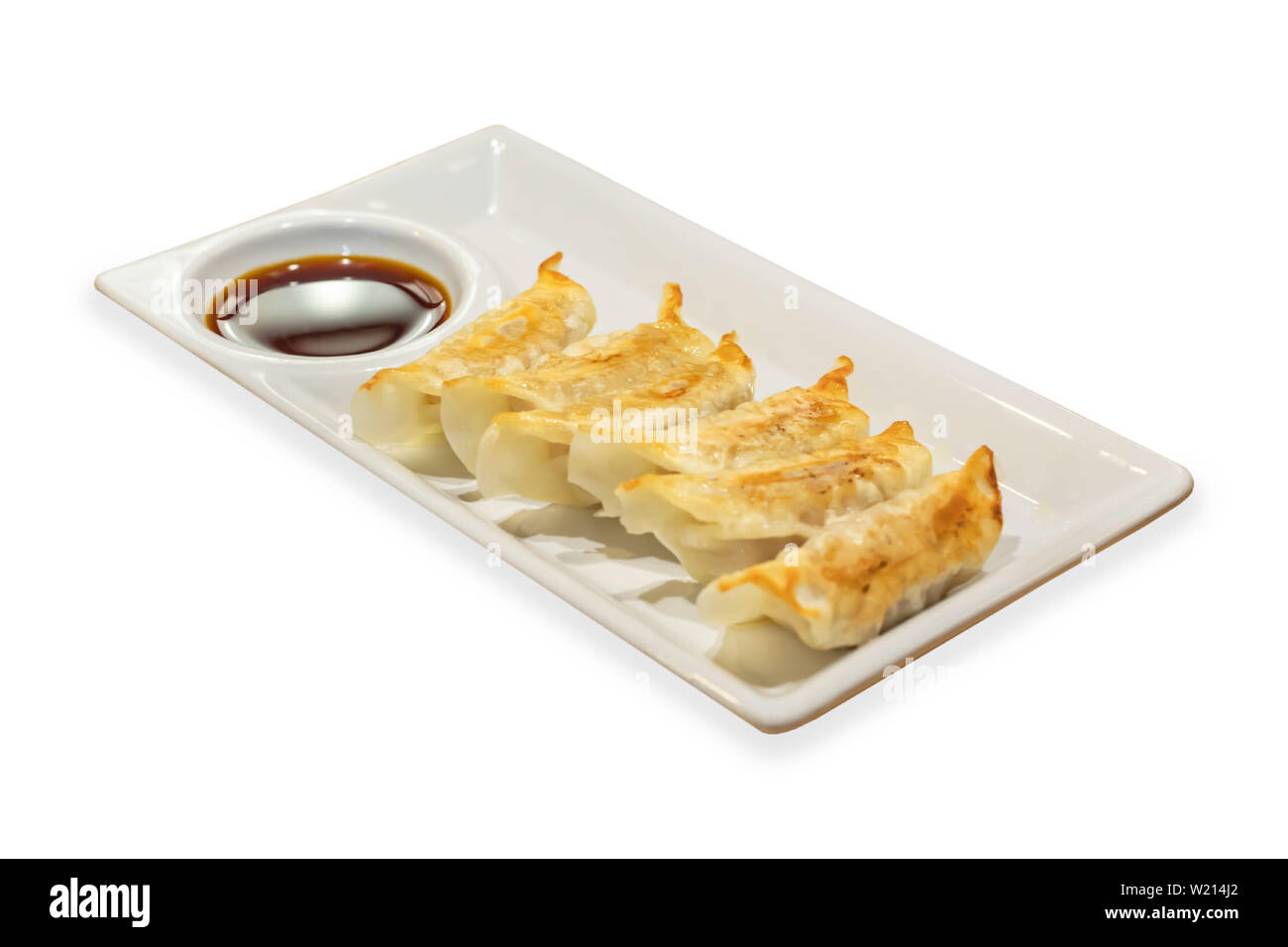 Gyoza and sauce in plate on a white background with clipping path Stock ...