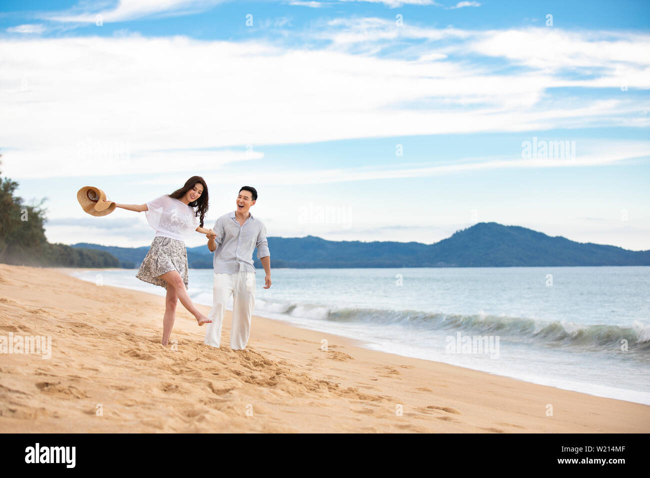 Couple having fun on beach hi-res stock photography and images - Alamy