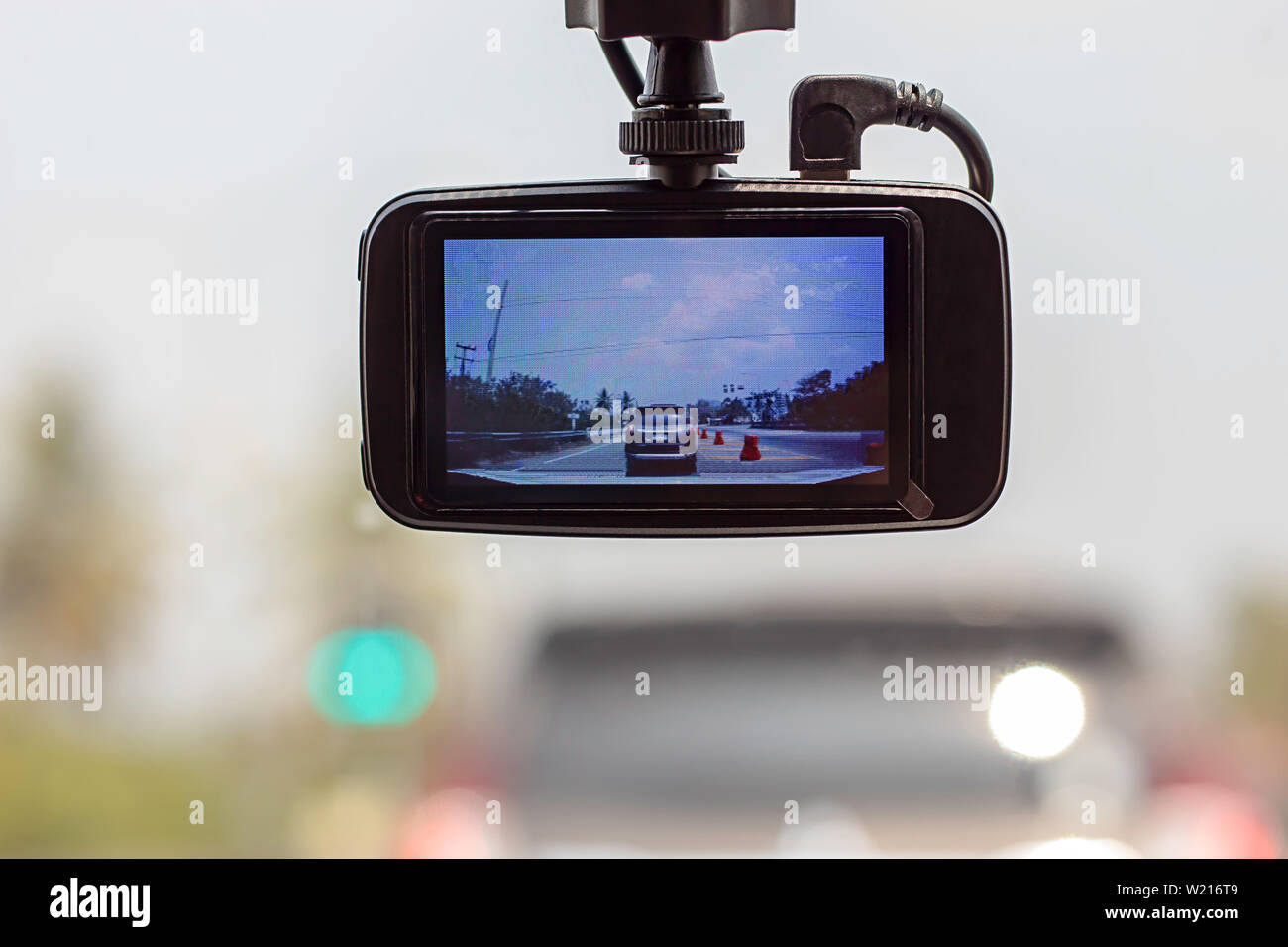 Picture cars and sky on camera in car Stock Photo - Alamy
