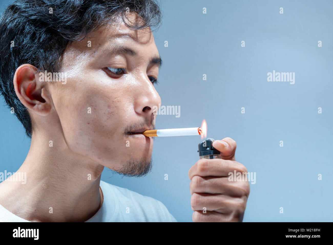 Man with lighter hi-res stock photography and images - Alamy