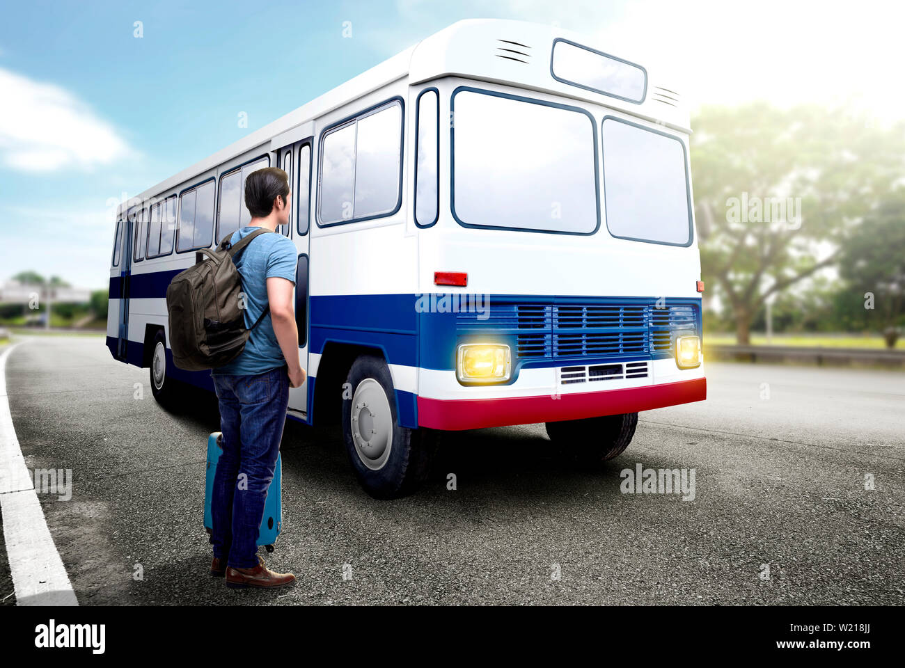 Rear view of asian man with suitcase bag and backpack standing and ...