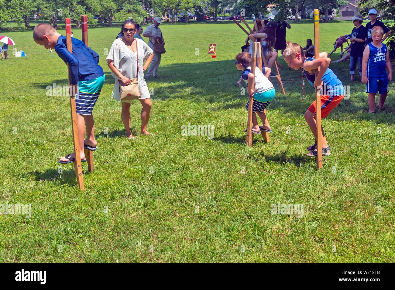 Old fashioned children stilts hi-res stock photography and images - Alamy