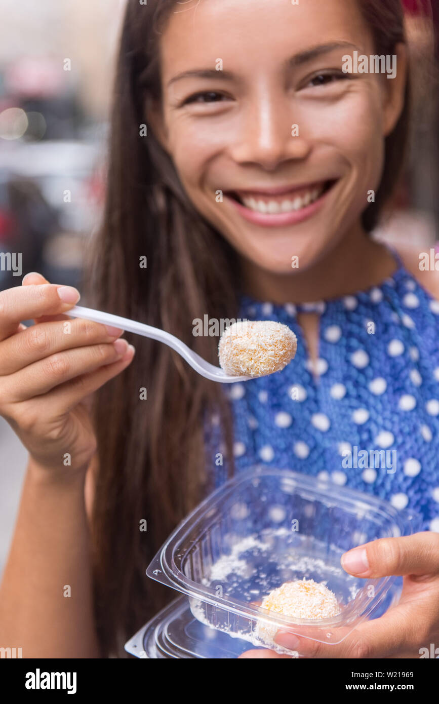 Asian woman eating japanese food on Asia travel. Mixed race Chinese ...