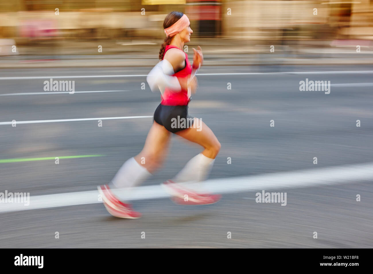 Marathon runner in motion on the street. Healthy lifestyle. Exercise ...