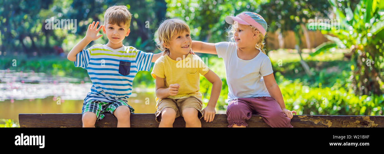 Children rest during a hike in the woods BANNER, LONG FORMAT Stock ...