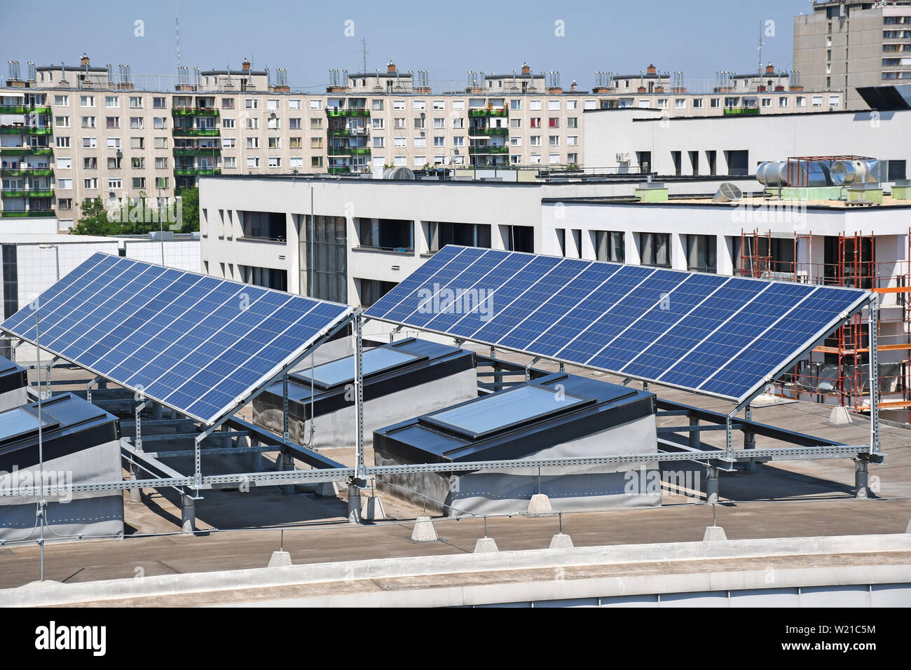 Solar panels on the top of a building Stock Photo - Alamy