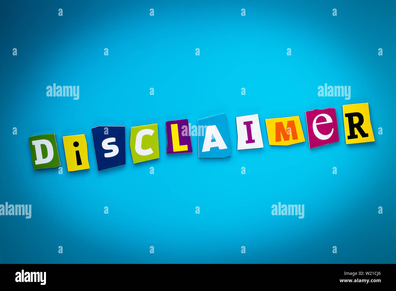 Single word - disclaimer from cut colorful letters on blue background ...