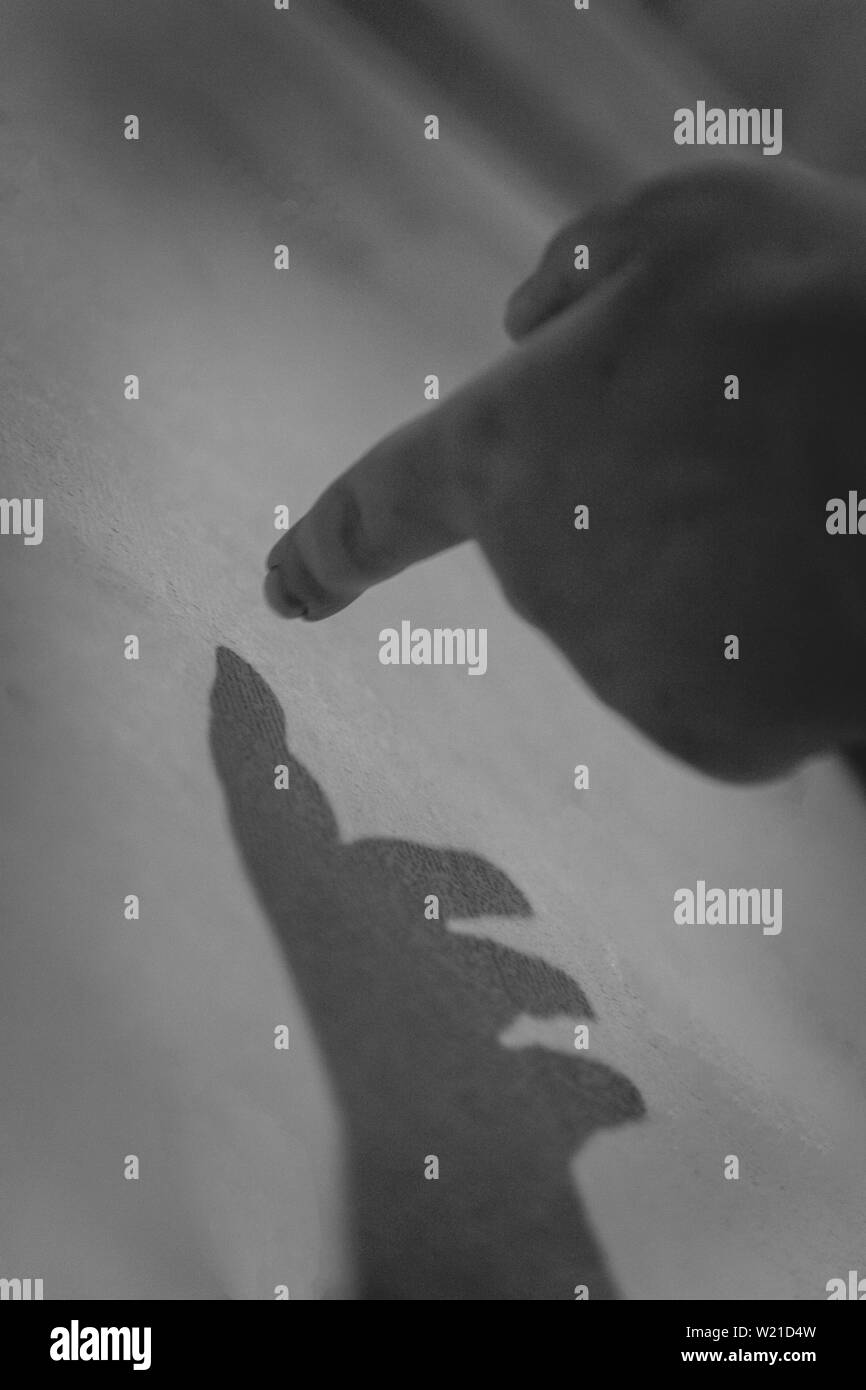Scary hand shadow on wall hi-res stock photography and images - Alamy