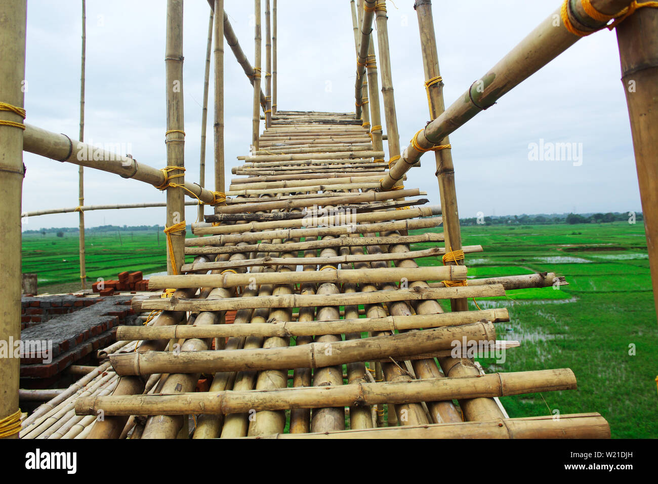 Bamboo steps for construction of temple work Stock Photo - Alamy