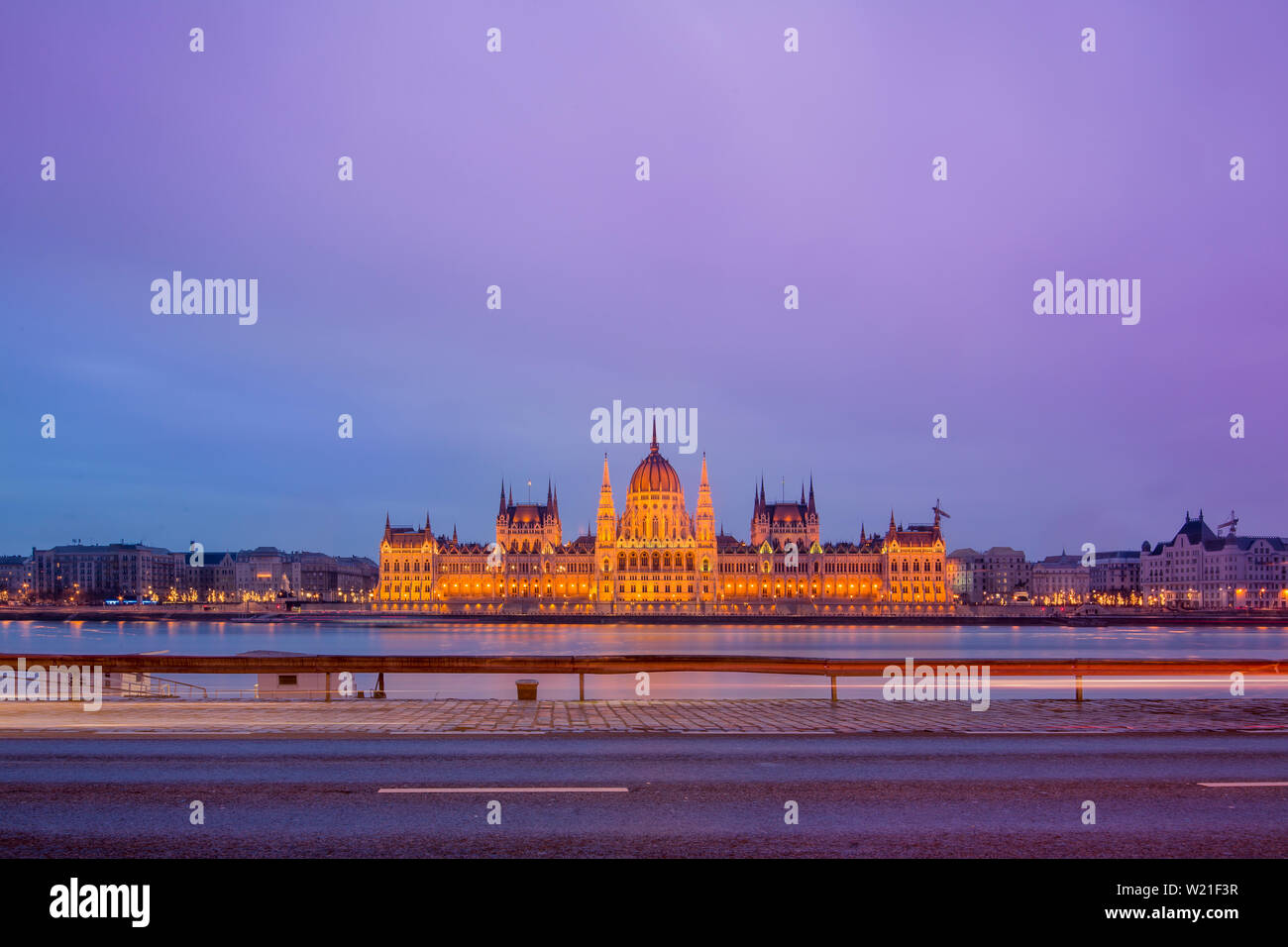 Cityscape of Budapest with colorful parliament and Danube river. Pink ...