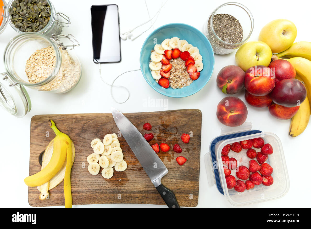 Healthy fitness breakfast preparation: oatmeal with bananas ...