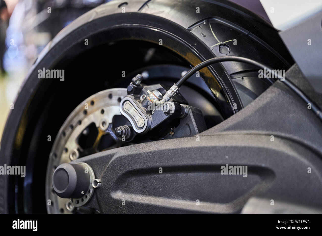 The rear wheel of a modern motorcycle Stock Photo - Alamy