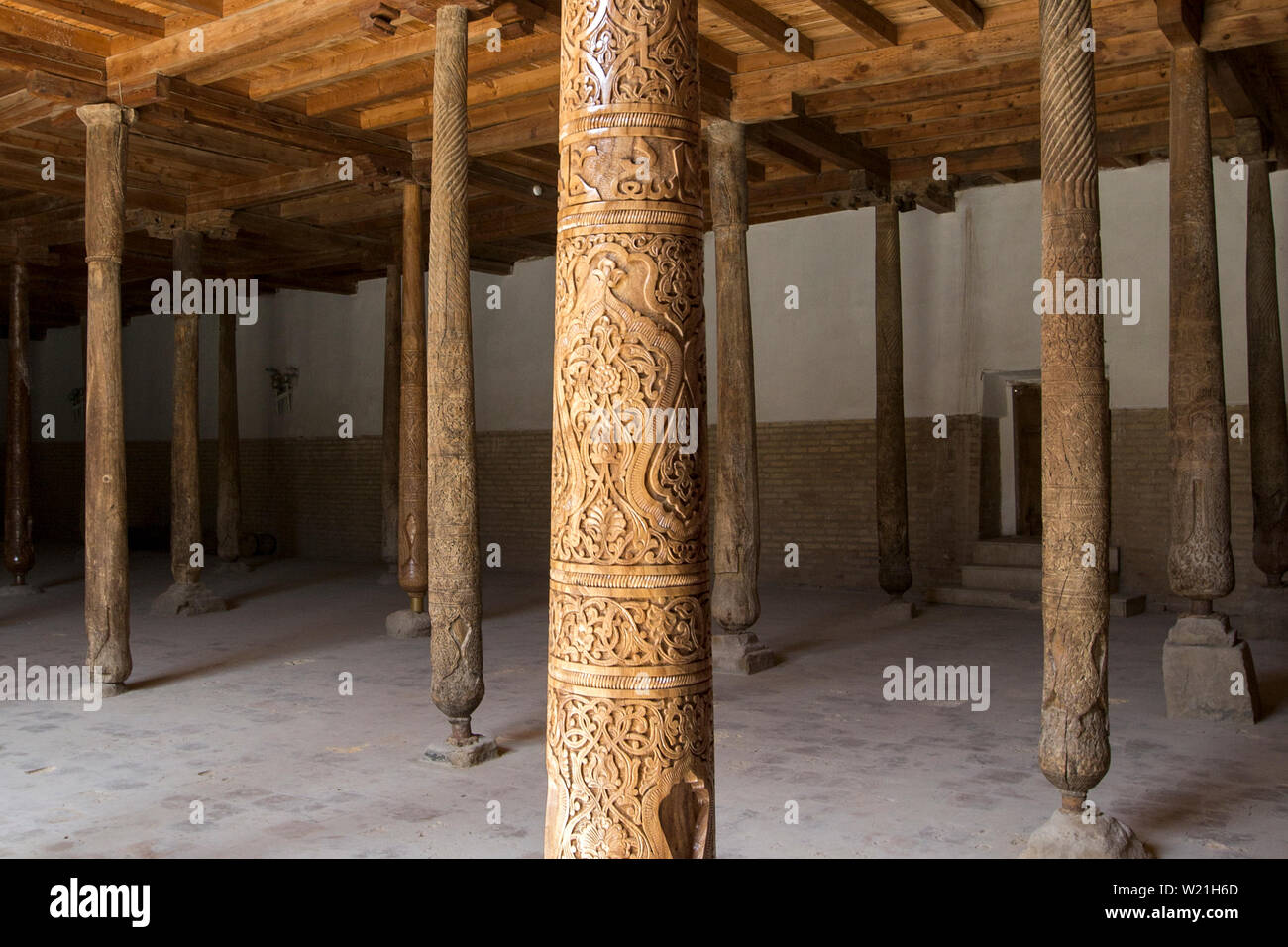 Interior of Friday or Djuma Mosque, showing ornate carved pillars ...