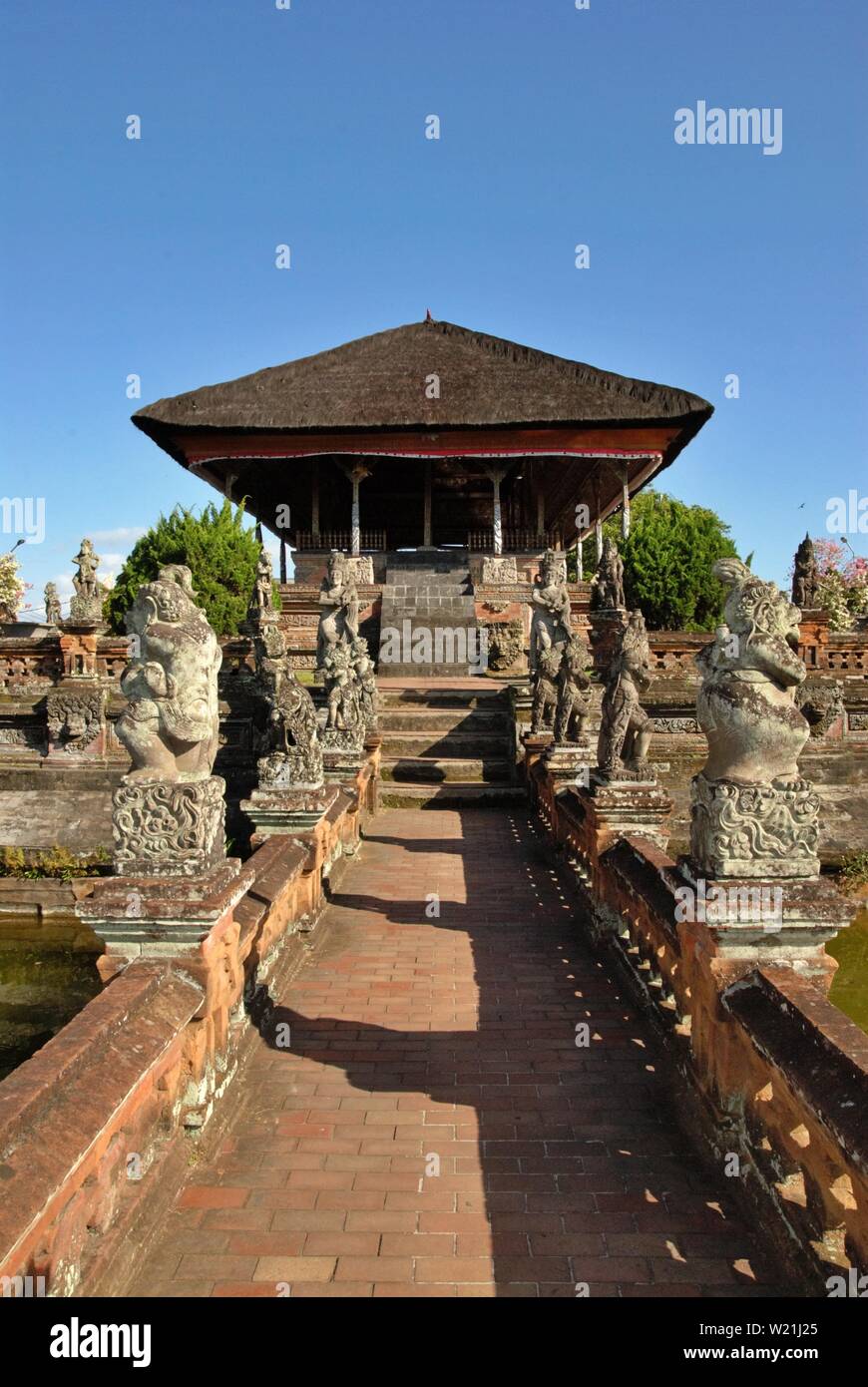 A way with traditional sculpture inside a traditional Balinese palace ...