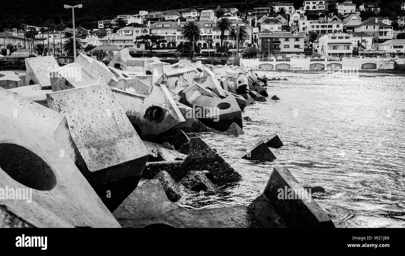 The Kalk Bay harbour wall has placed dolosses to protect the small ...
