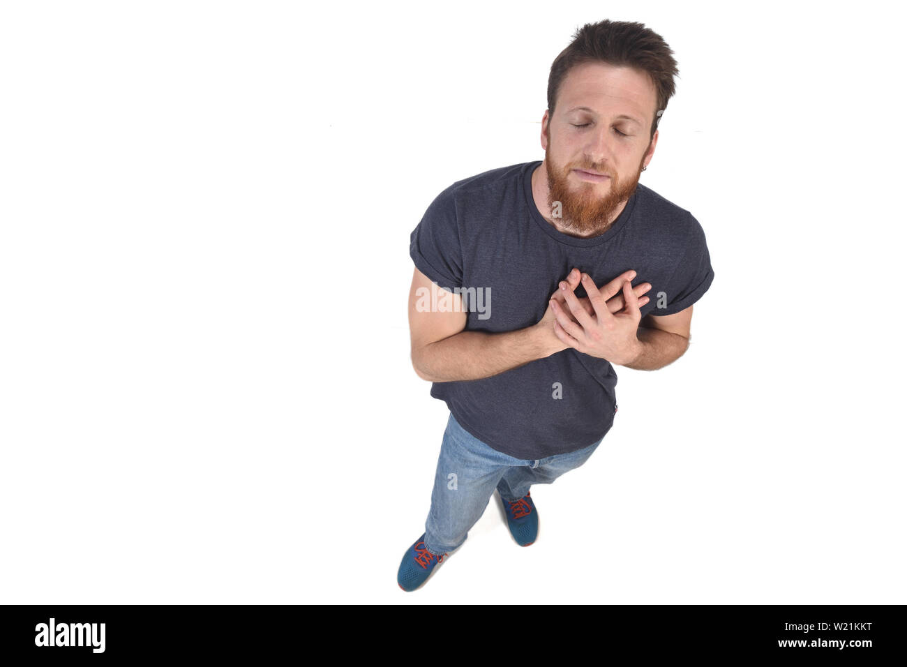 man with hand on heart on white background Stock Photo - Alamy