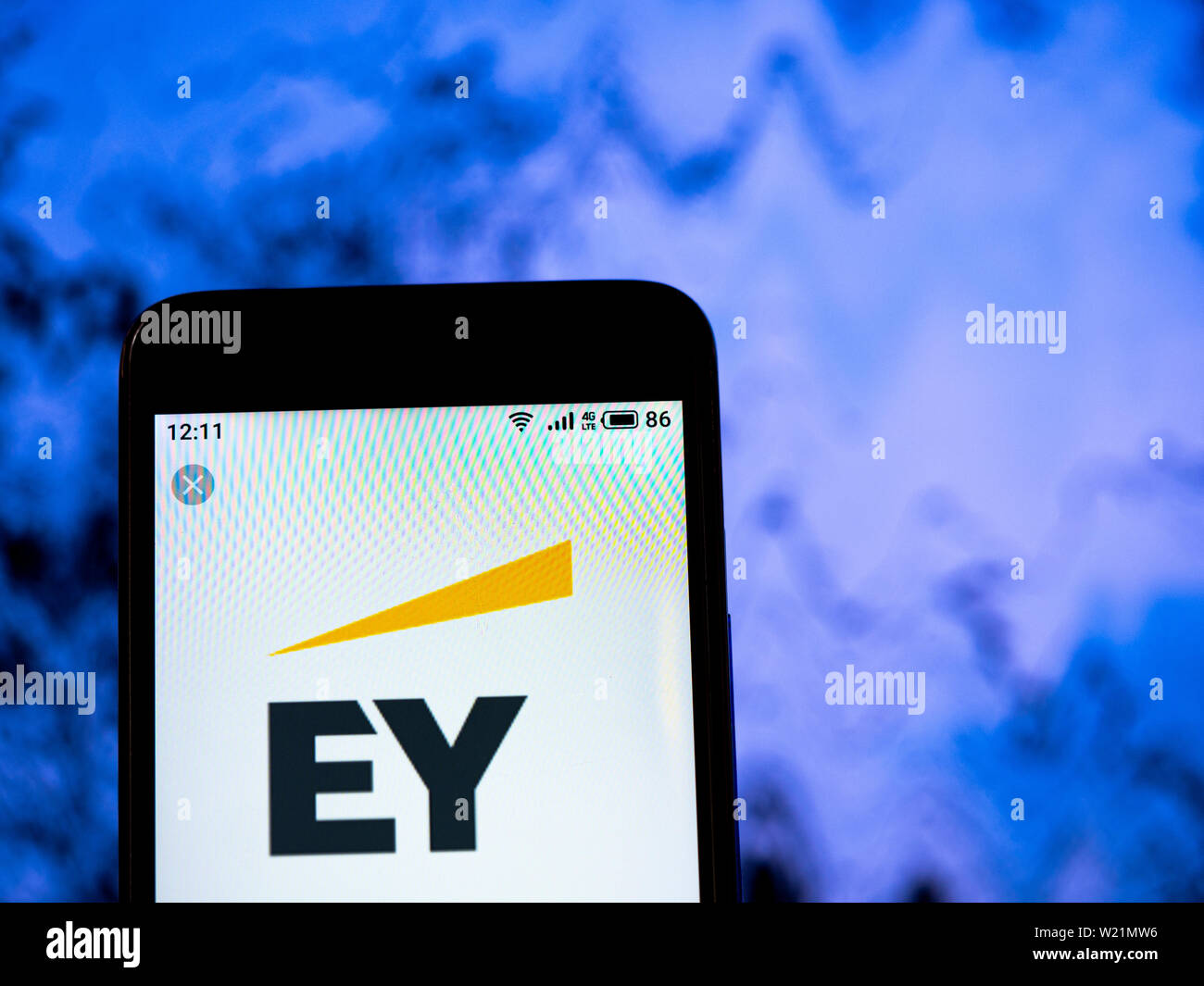 In this photo illustration the Ernst & Young logo is seen displayed on ...