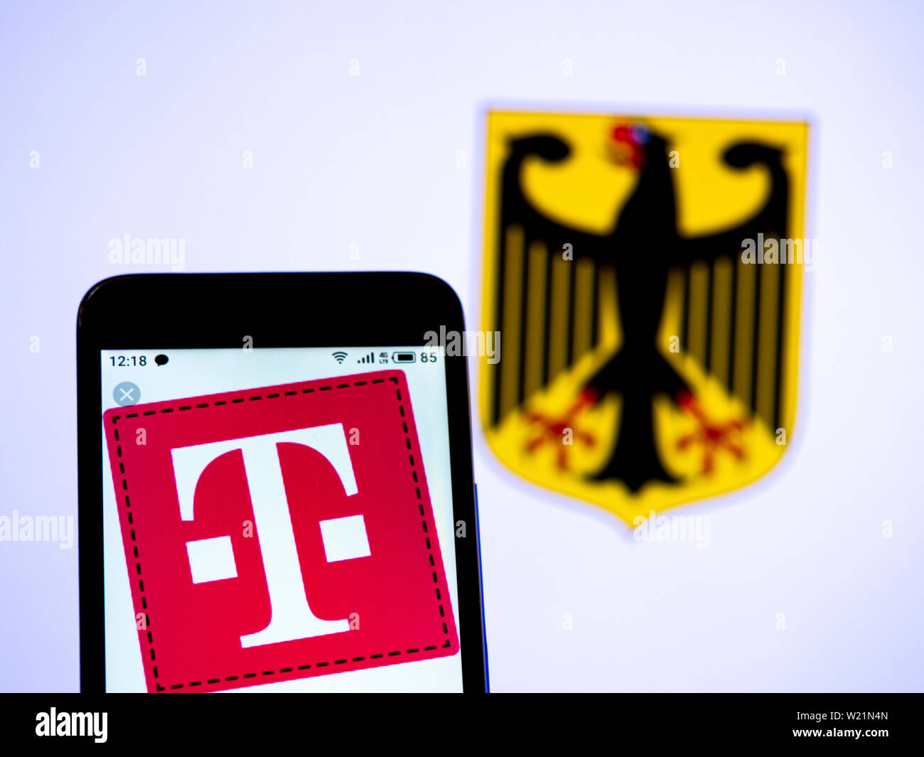 In this photo illustration the T-Systems logo is seen displayed on a ...