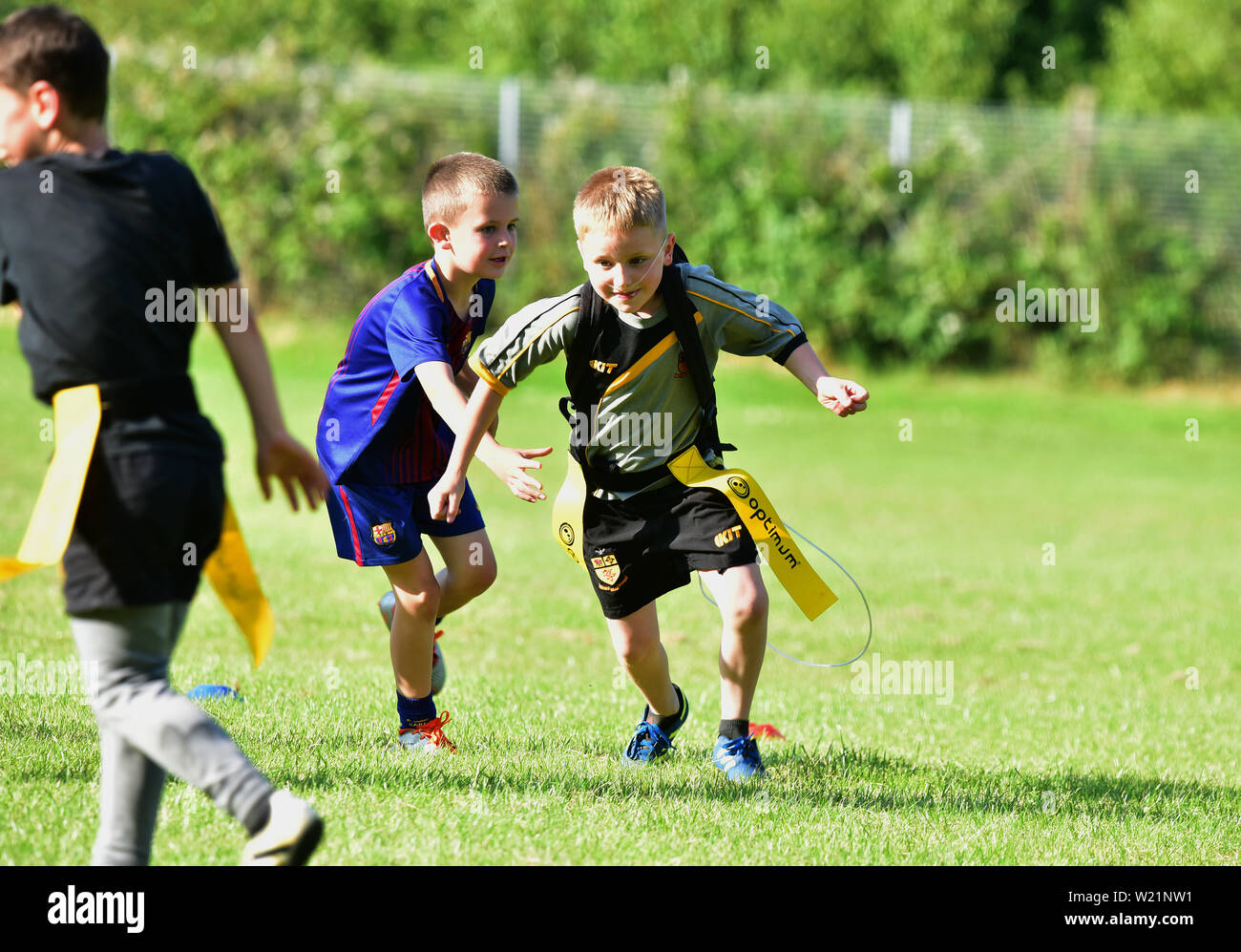 8-year-old Riley Davies playing rugby with an oxygen tank on his back ...