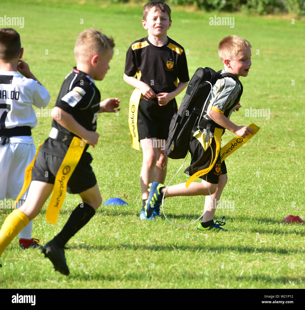8-year-old Riley Davies playing rugby with an oxygen tank on his back ...