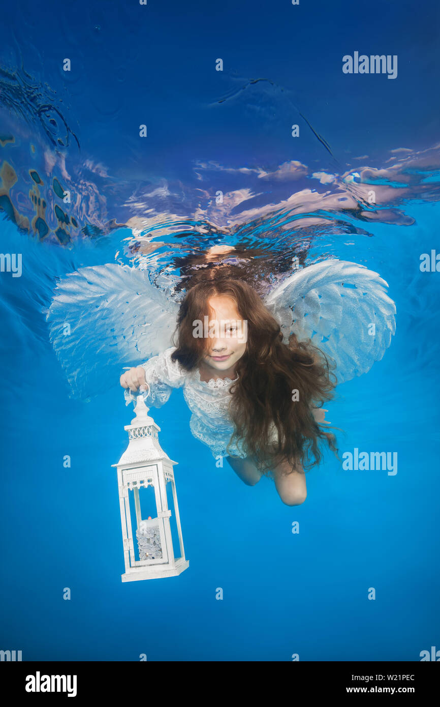 Angel blue dress hi-res stock photography and images - Alamy