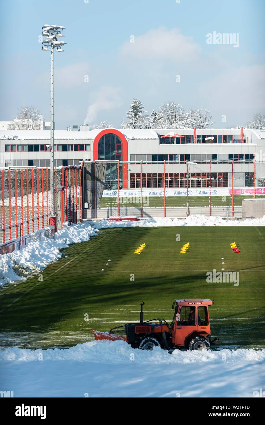 Snowplough clears snow at the football pitch, FC Bayern Munich, Upper ...