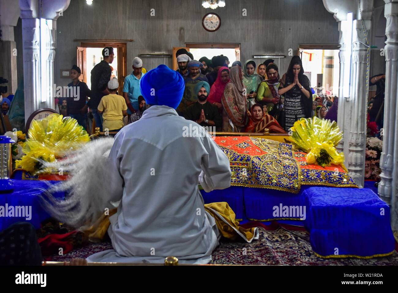 Devotees pray at a Sikh temple during a birth anniversary of the sixth ...