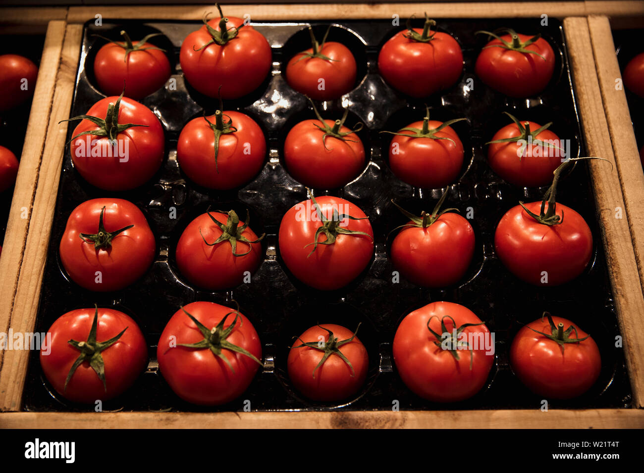 A close-up shot of an abundance of fresh Red Tomatoes on display at a ...