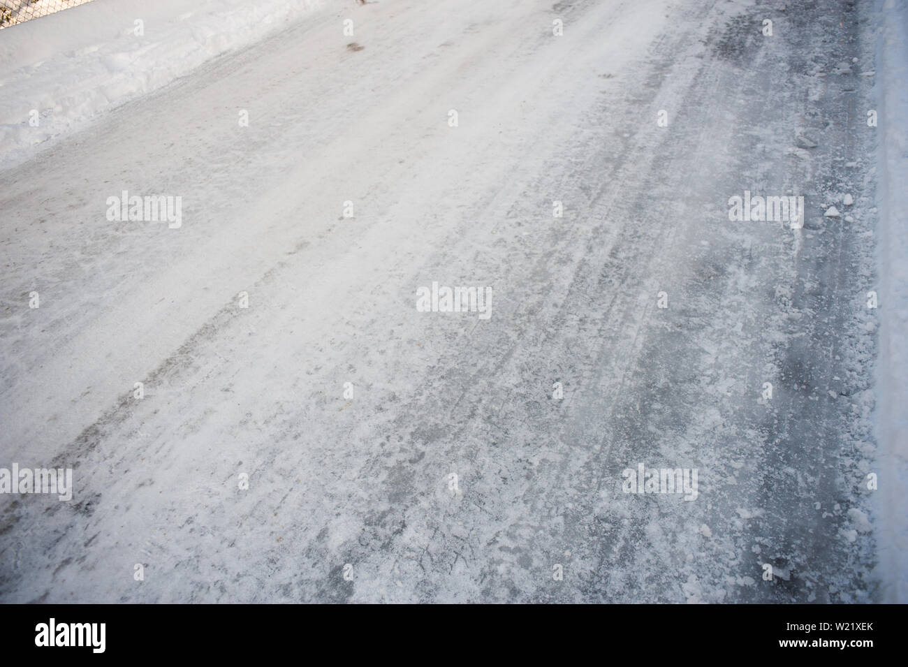 Thin frozen ice on the street. Urban scenario Stock Photo - Alamy