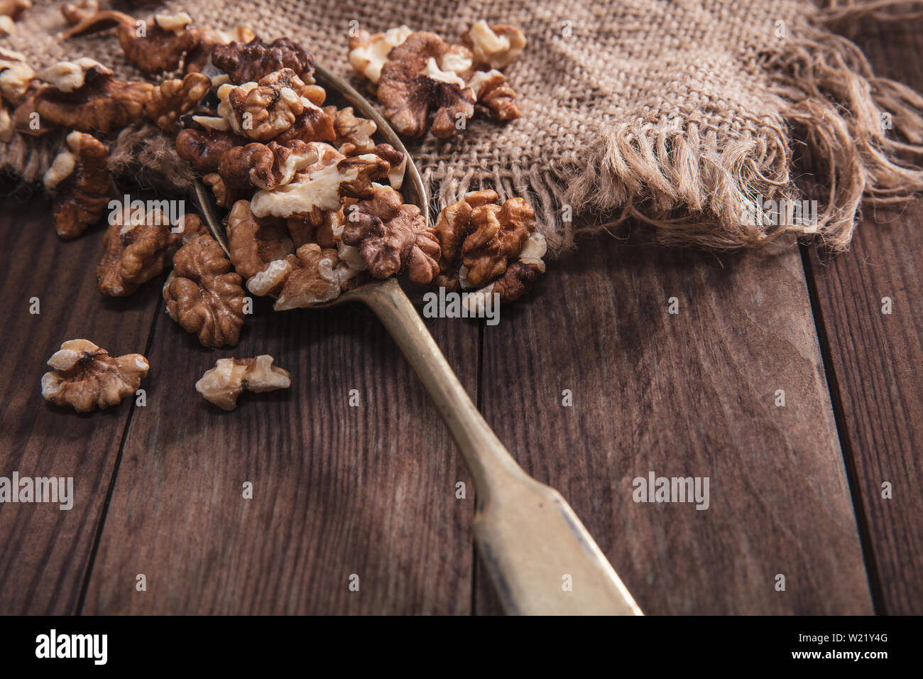Walnuts on an old spoon and composition from old wood and material ...